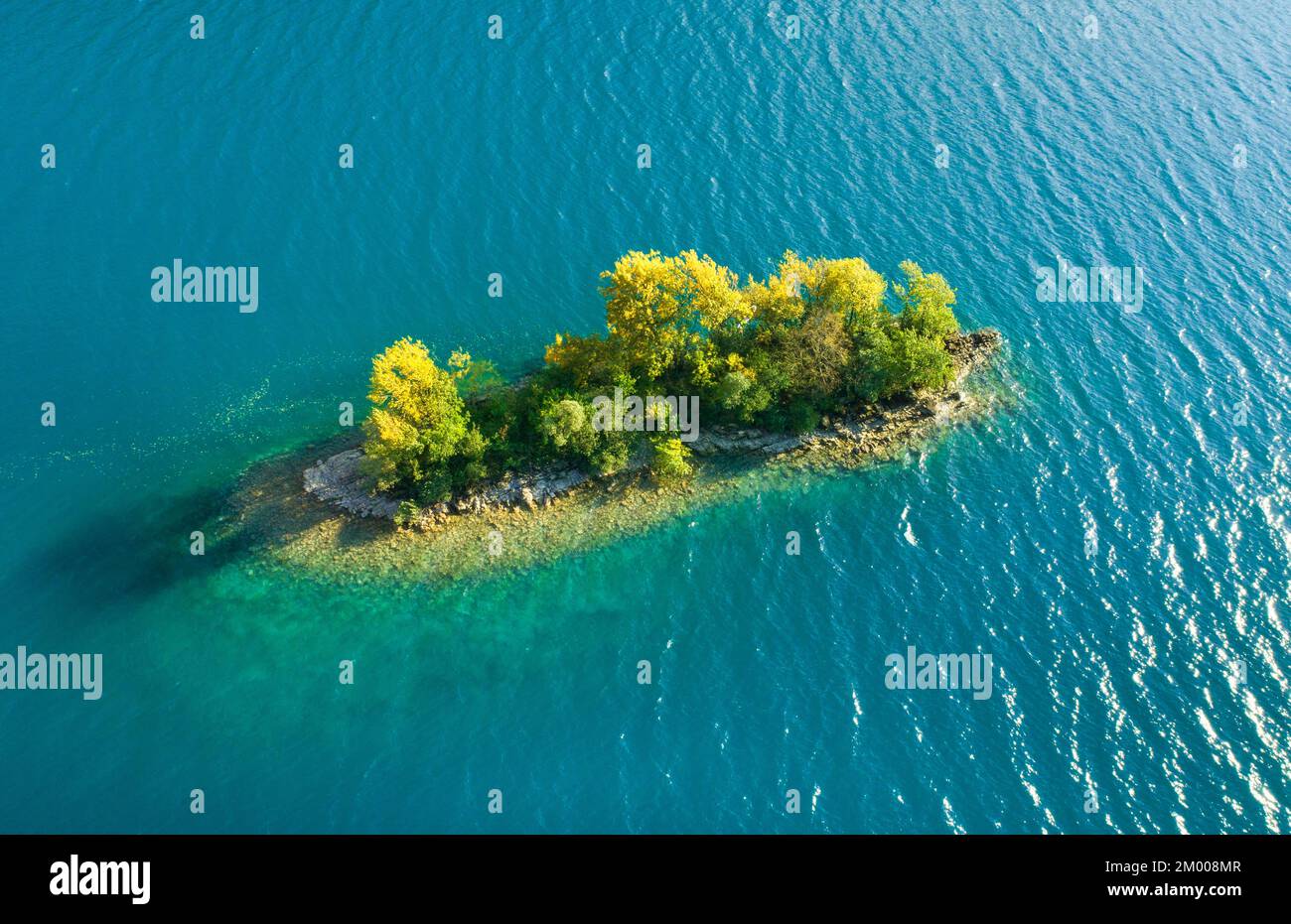 Bird's eye view of the chive island in the turquoise waters of Lake ...