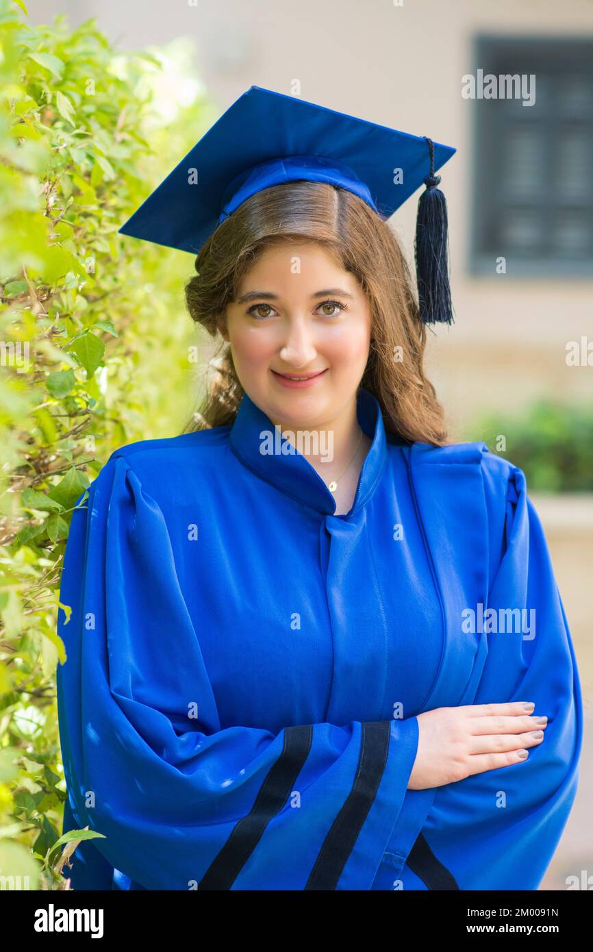Beautiful female university graduate outdoors Stock Photo - Alamy