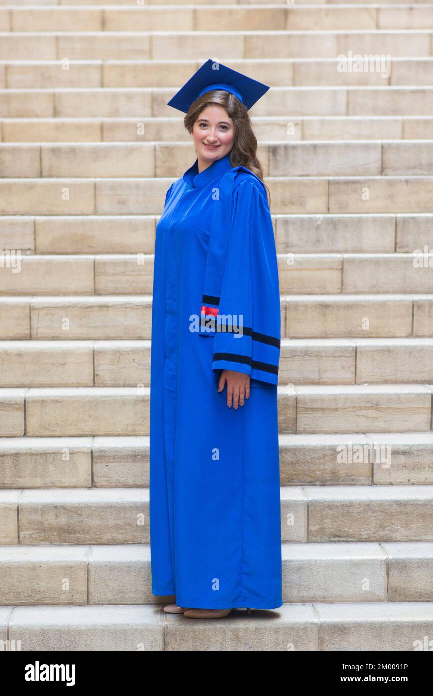 Beautiful female university graduate outdoors Stock Photo - Alamy