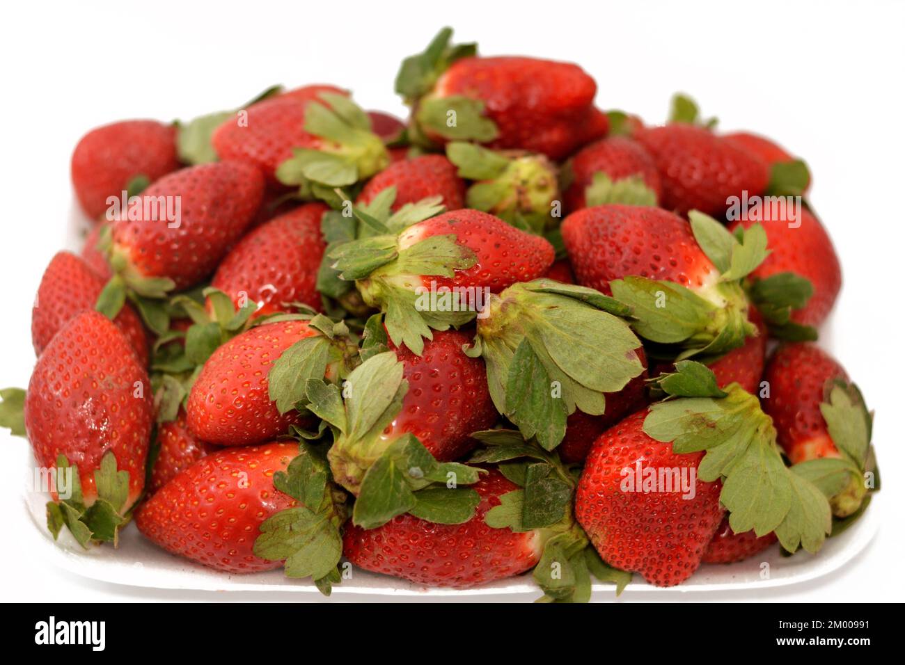 Pile of fresh strawberries fruit, the garden strawberry is a widely ...
