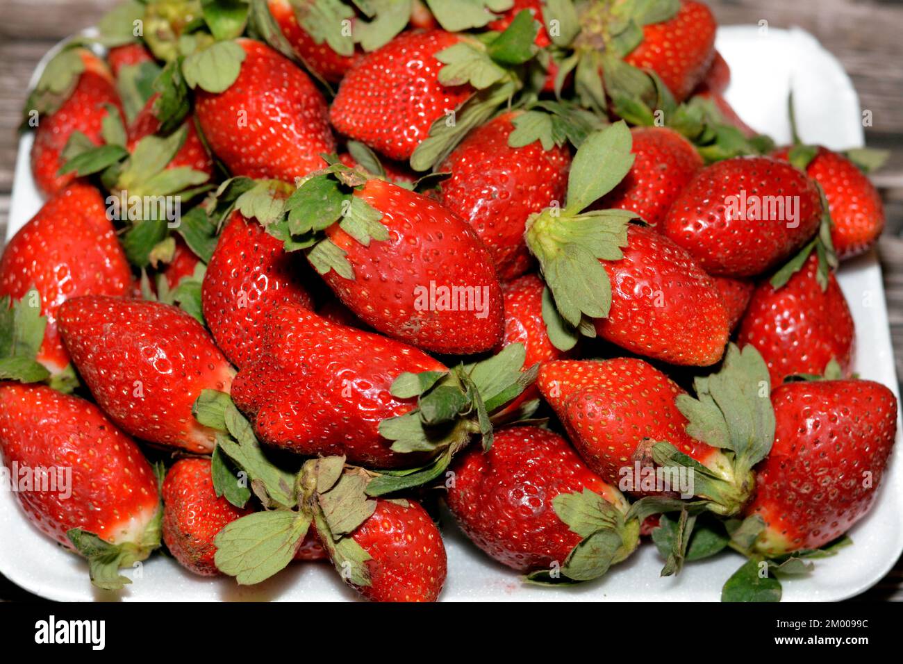 Pile of fresh strawberries fruit, the garden strawberry is a widely ...