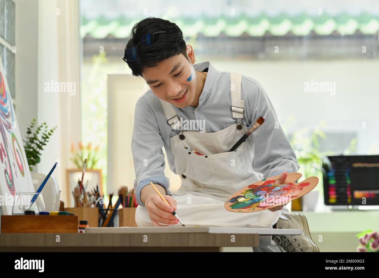 Talented asian male artist hi-res stock photography and images - Alamy