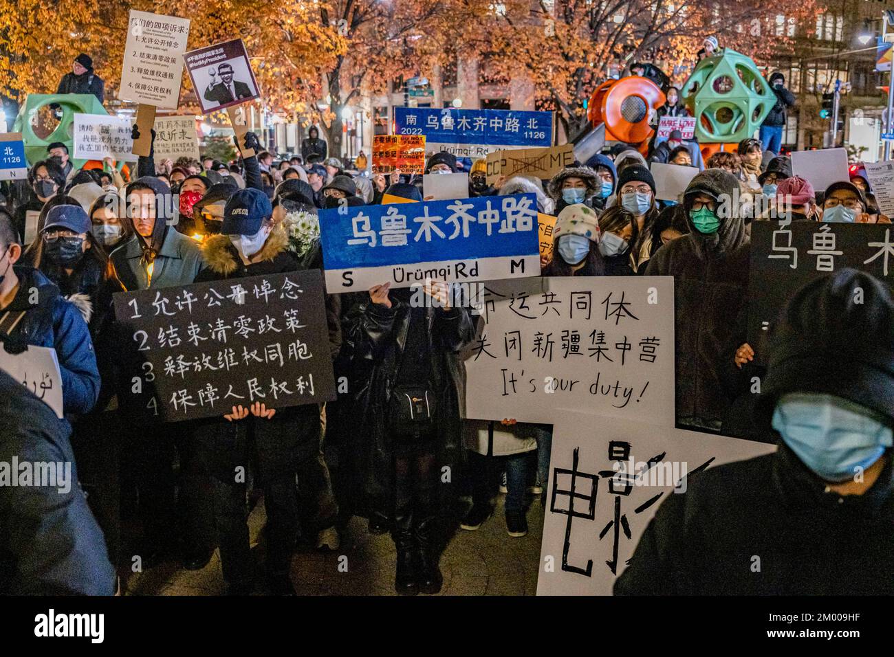 Boston, United States. 02nd Dec, 2022. Demonstrators hold white papers ...