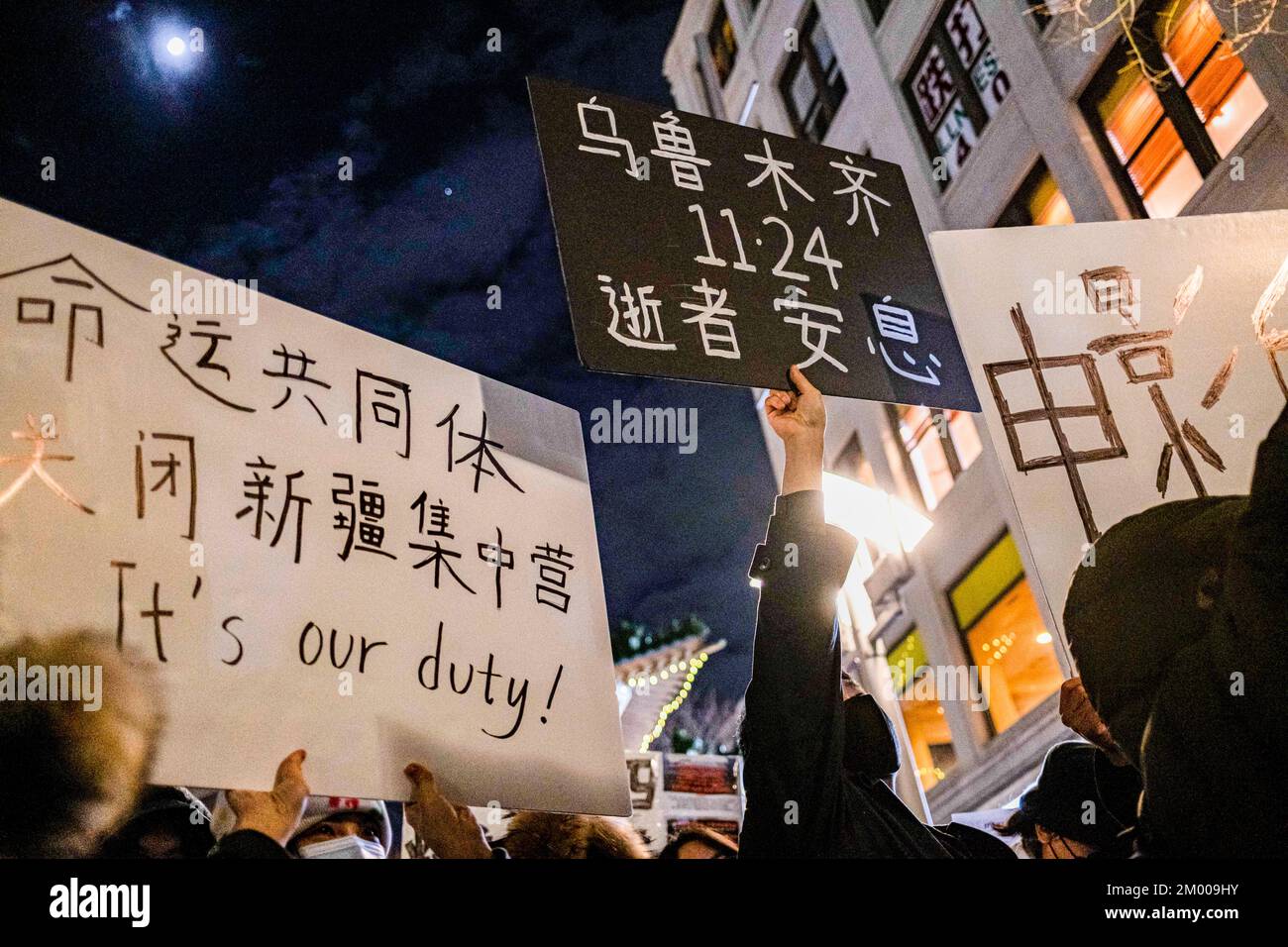 Boston, United States. 02nd Dec, 2022. Demonstrators hold placards ...