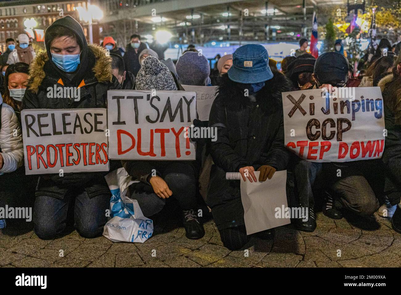 Boston, United States. 02nd Dec, 2022. Demonstrators morn and hold ...