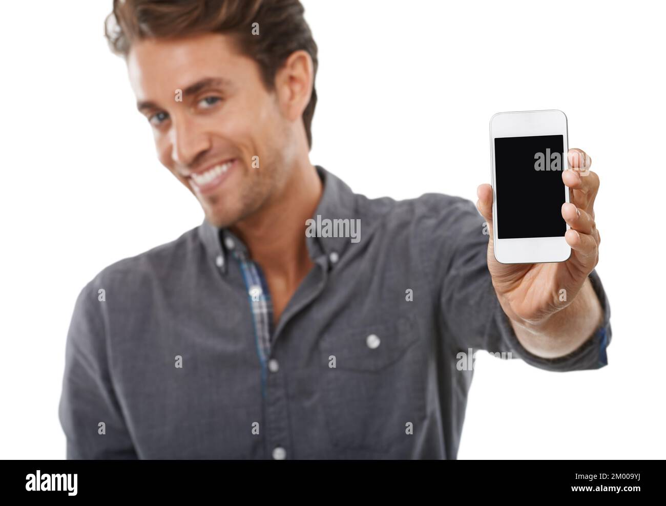 The latest smartphone. Portrait of a handsome young man showing you his ...