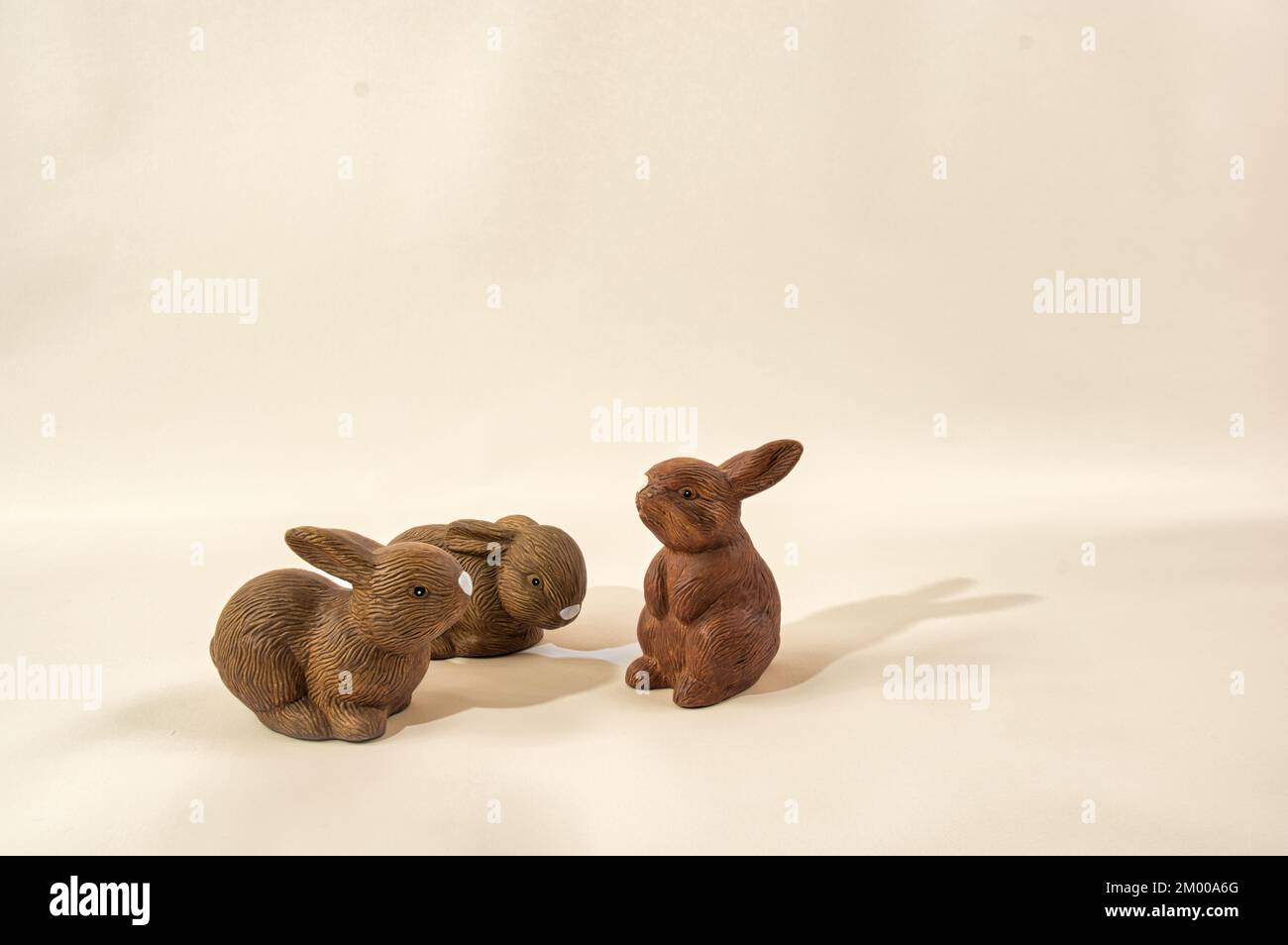 three rabbits talking Stock Photo - Alamy