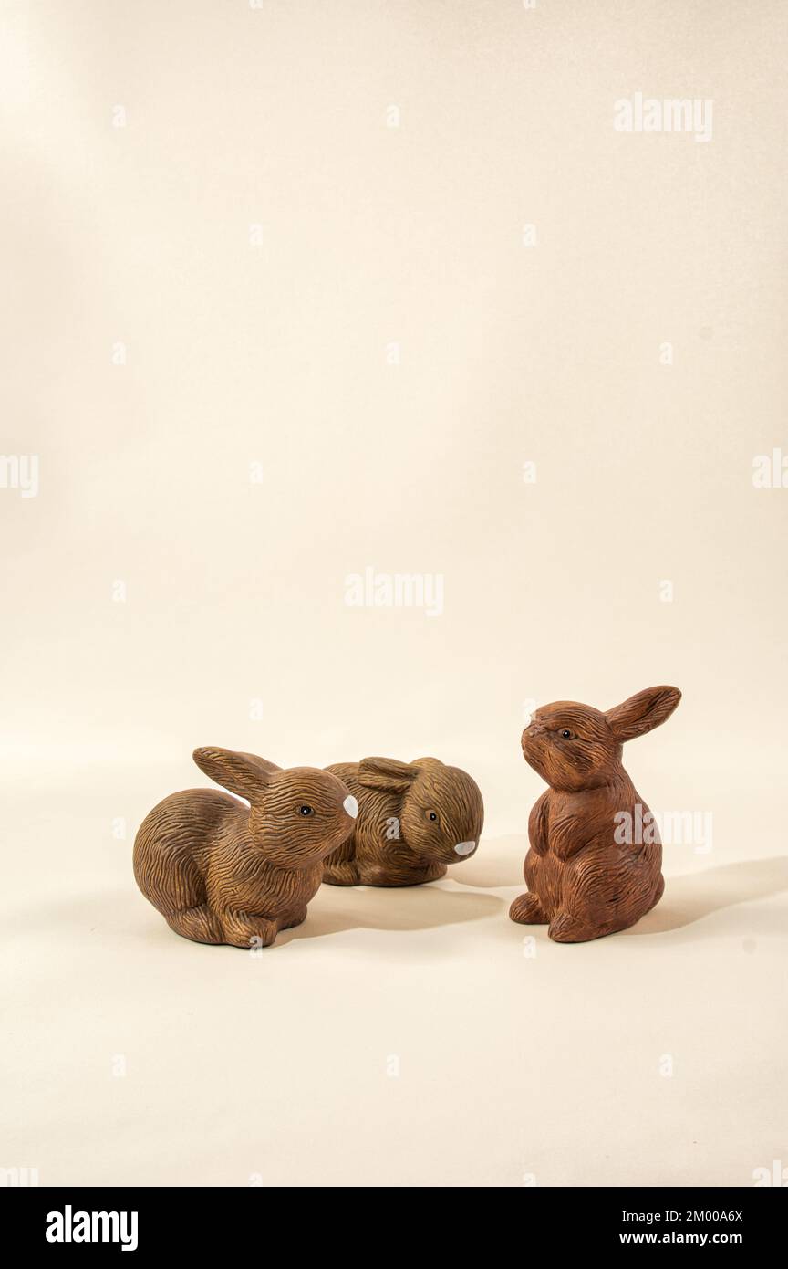 three rabbits talking Stock Photo - Alamy