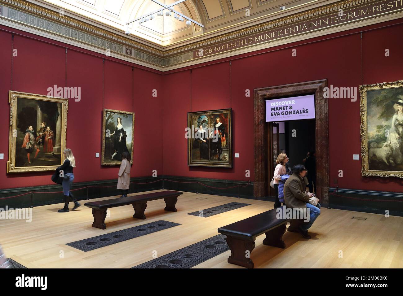 Visitors study Renaissance paintings in the National Gallery, London ...