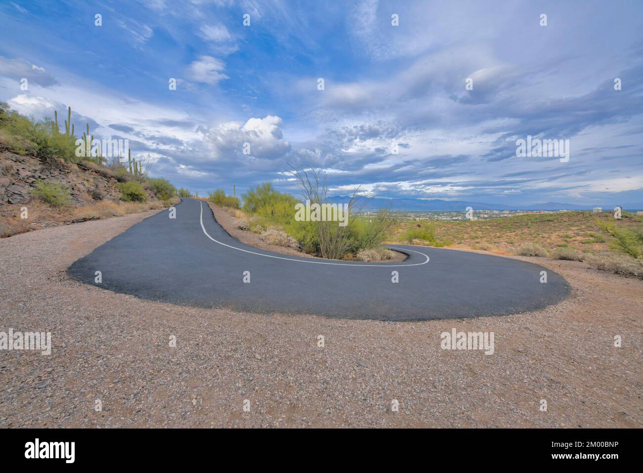 U-shaped asphalt bike path and walkway with an overlooking view of ...