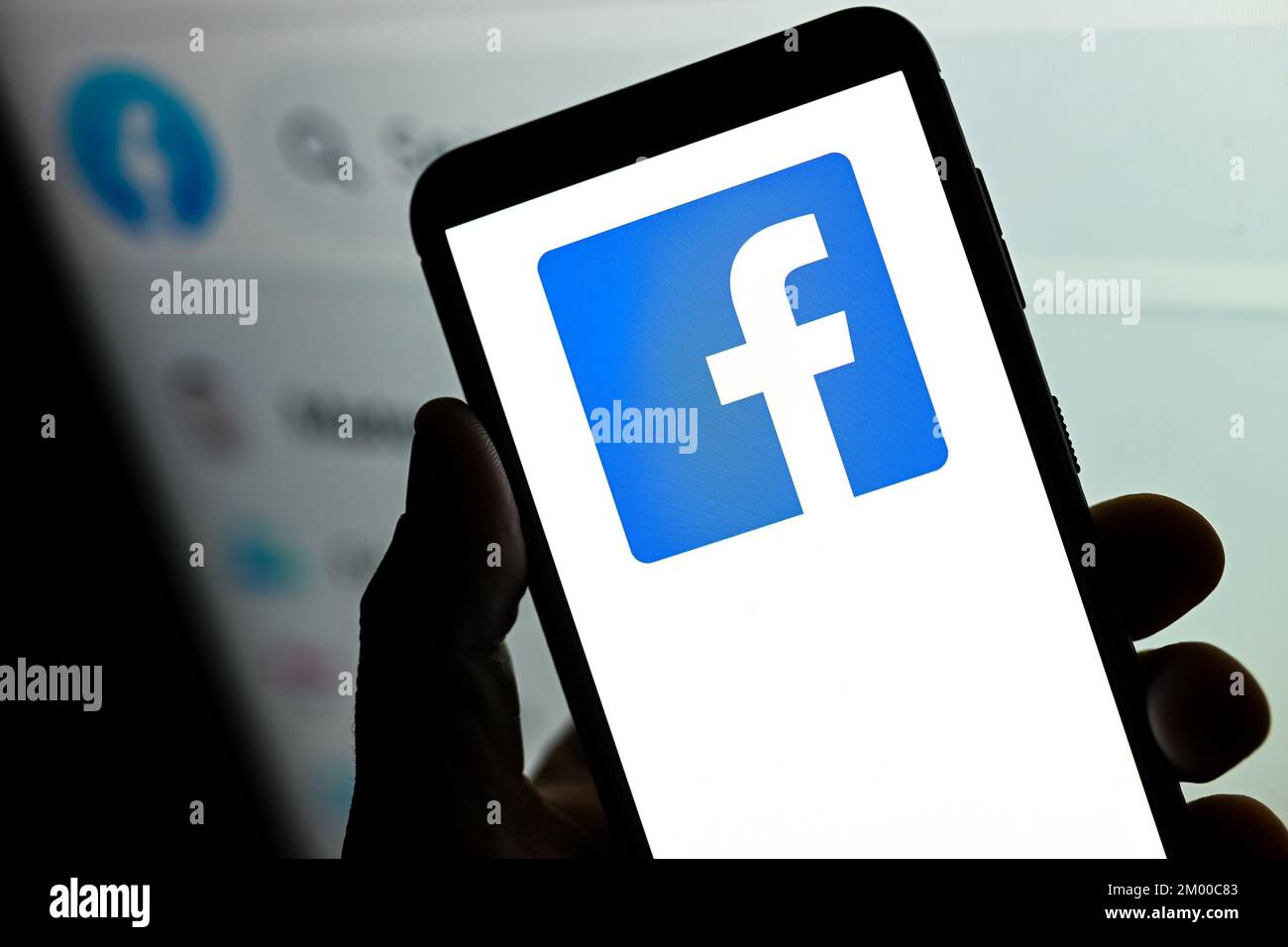 In this photo illustration a Facebook logo seen displayed on a ...