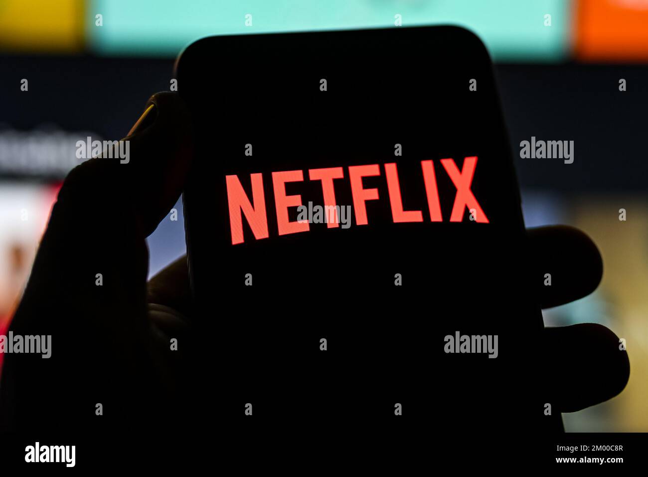 In this photo illustration a Netflix logo seen displayed on a smartphone. (Photo by Mateusz ...
