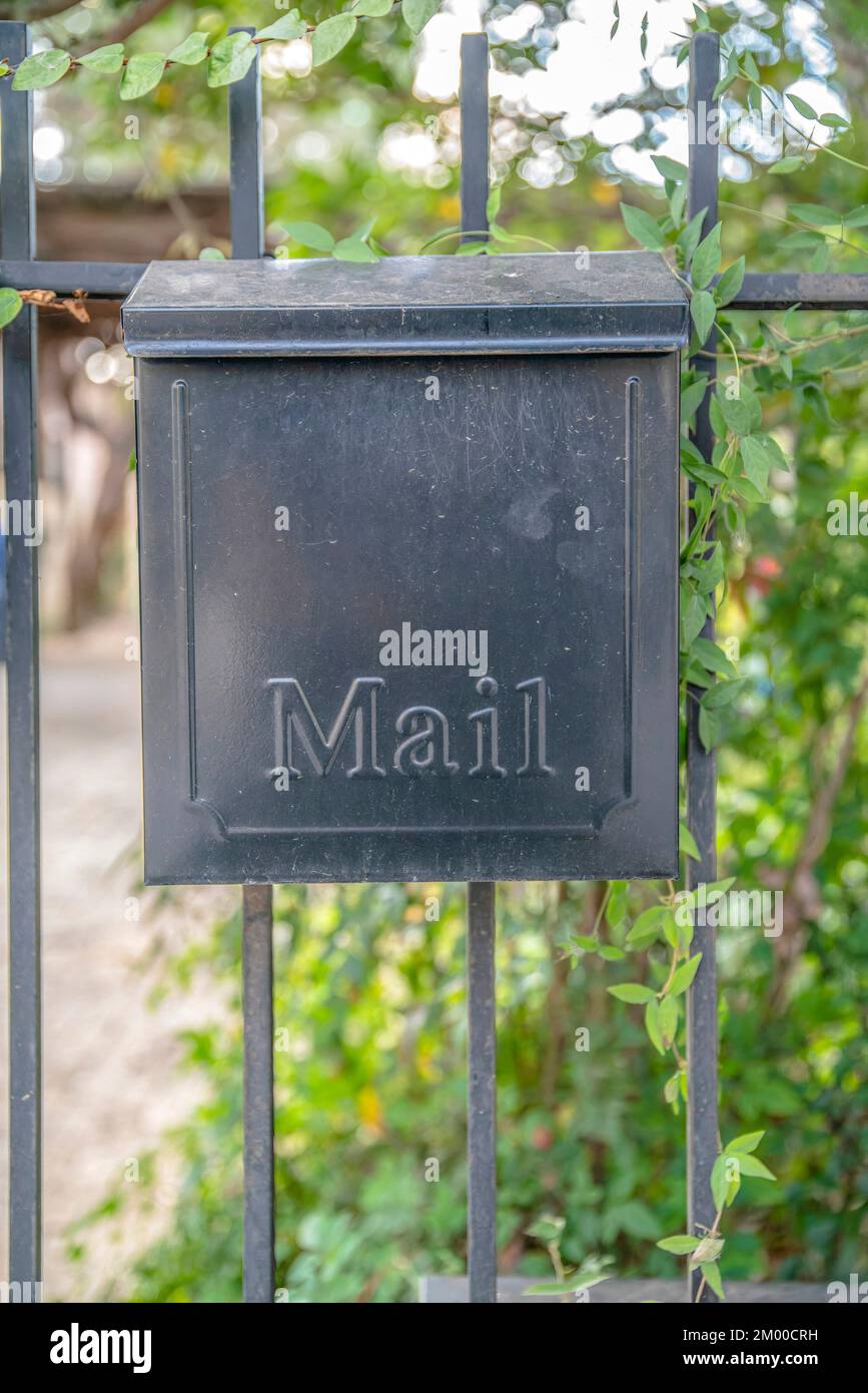 San Antonio, Texas- Black steel wall-mounted mailbox with embossed Mail ...