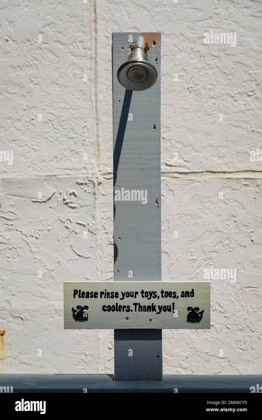 Destin, Florida- Signboard with Please rinse your toys, toes, and ...