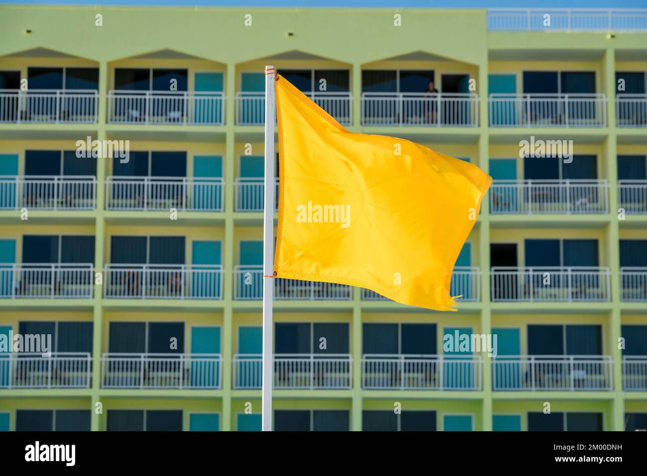 Destin, Florida- Close-up of a yellow flag on a pole. Yellow flag at ...