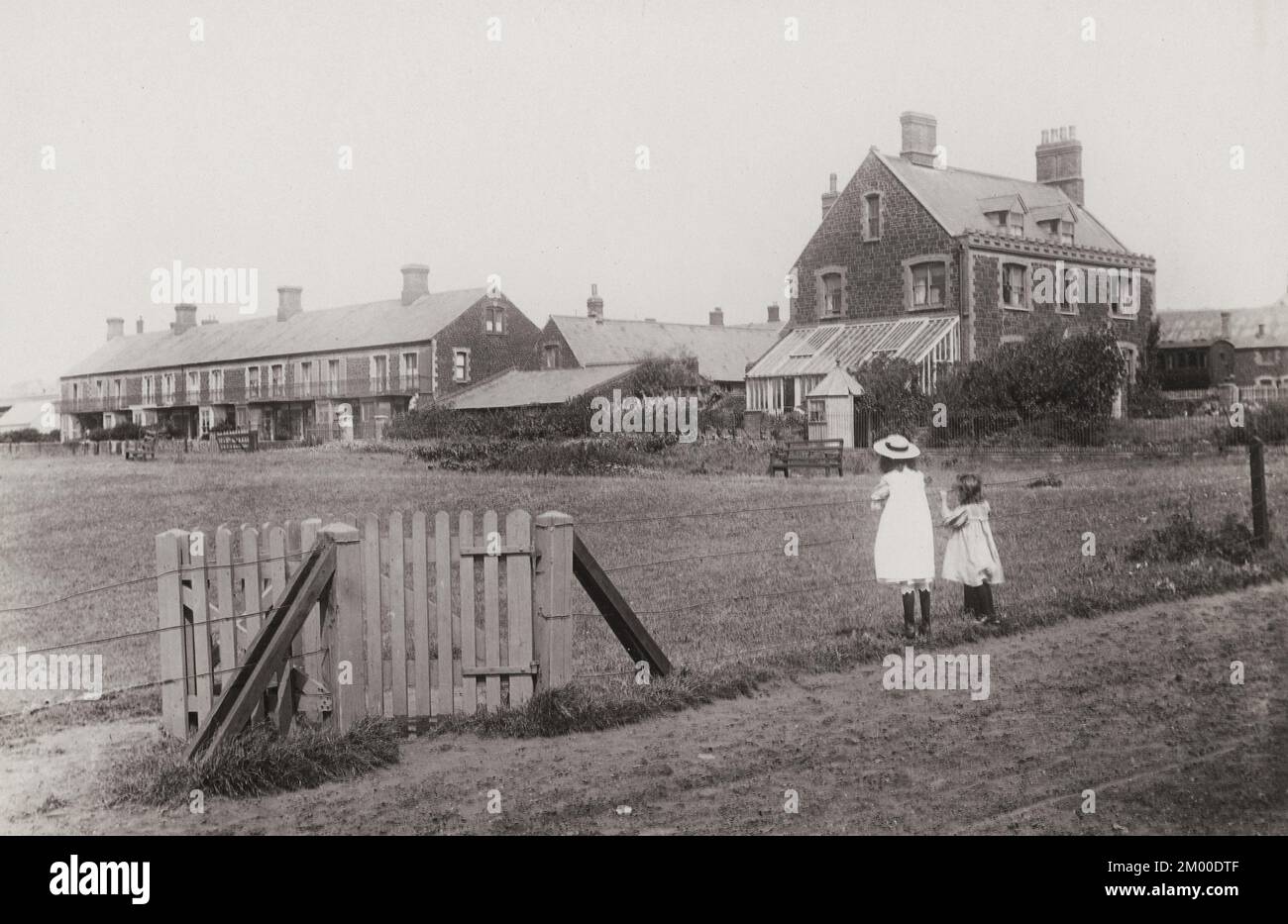 Vintage photograph - 1891 - Girls looking onto beach terrace houses ...