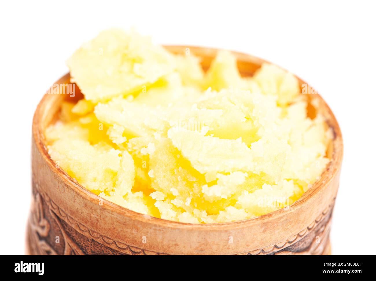 Ghee in wooden bowl isolated on white background Stock Photo - Alamy