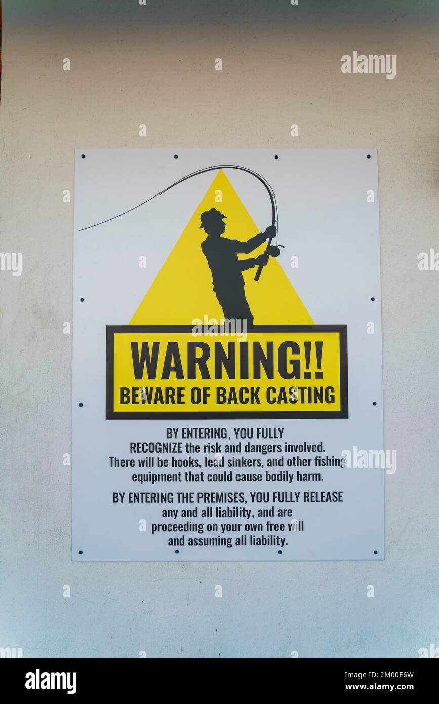 Destin, Florida- Sign on a wall with Warning Beware of Back Casting ...