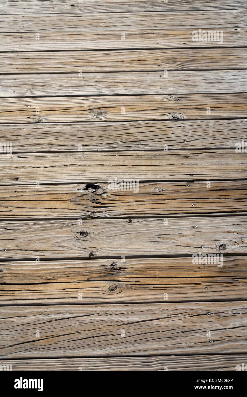 Destin, Florida- Horizontal rough wood planks flooring. Close-up view ...