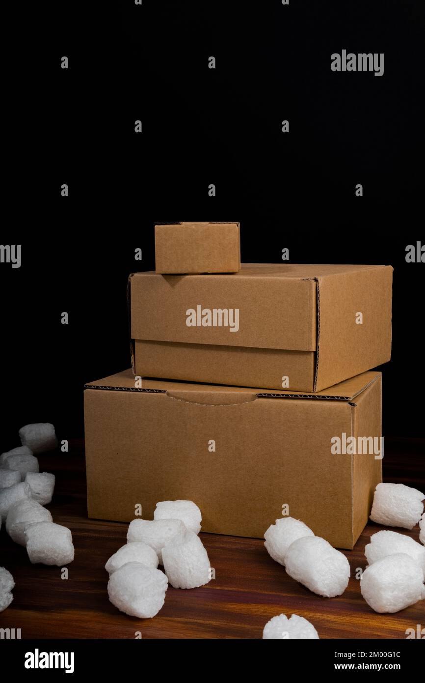 tower of cardboard boxes with shipping chips over dark background Stock ...