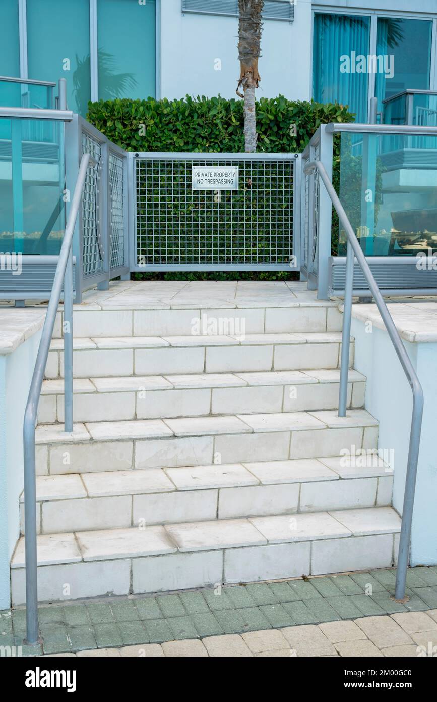 Staircase entrance with Private Property No Trespassing sign on a gate ...