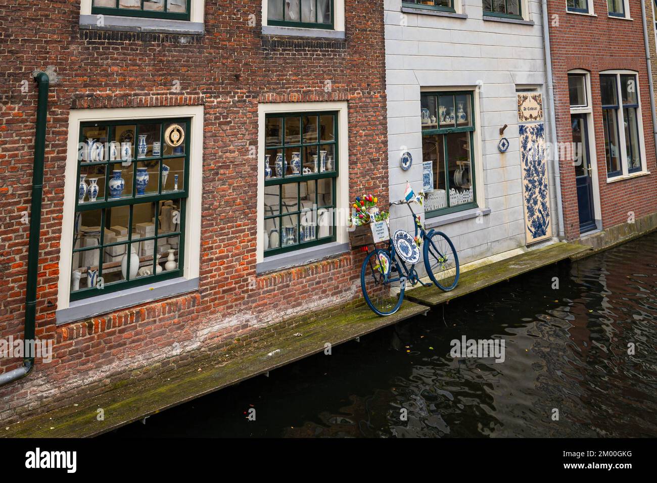 Picturesque view of a typical Dutch canal house, where typical Delft ...