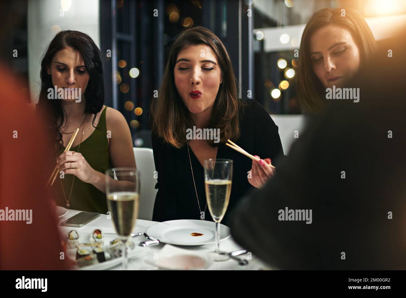 Friends, dinner party and at a restaurant for celebration, happiness or ...