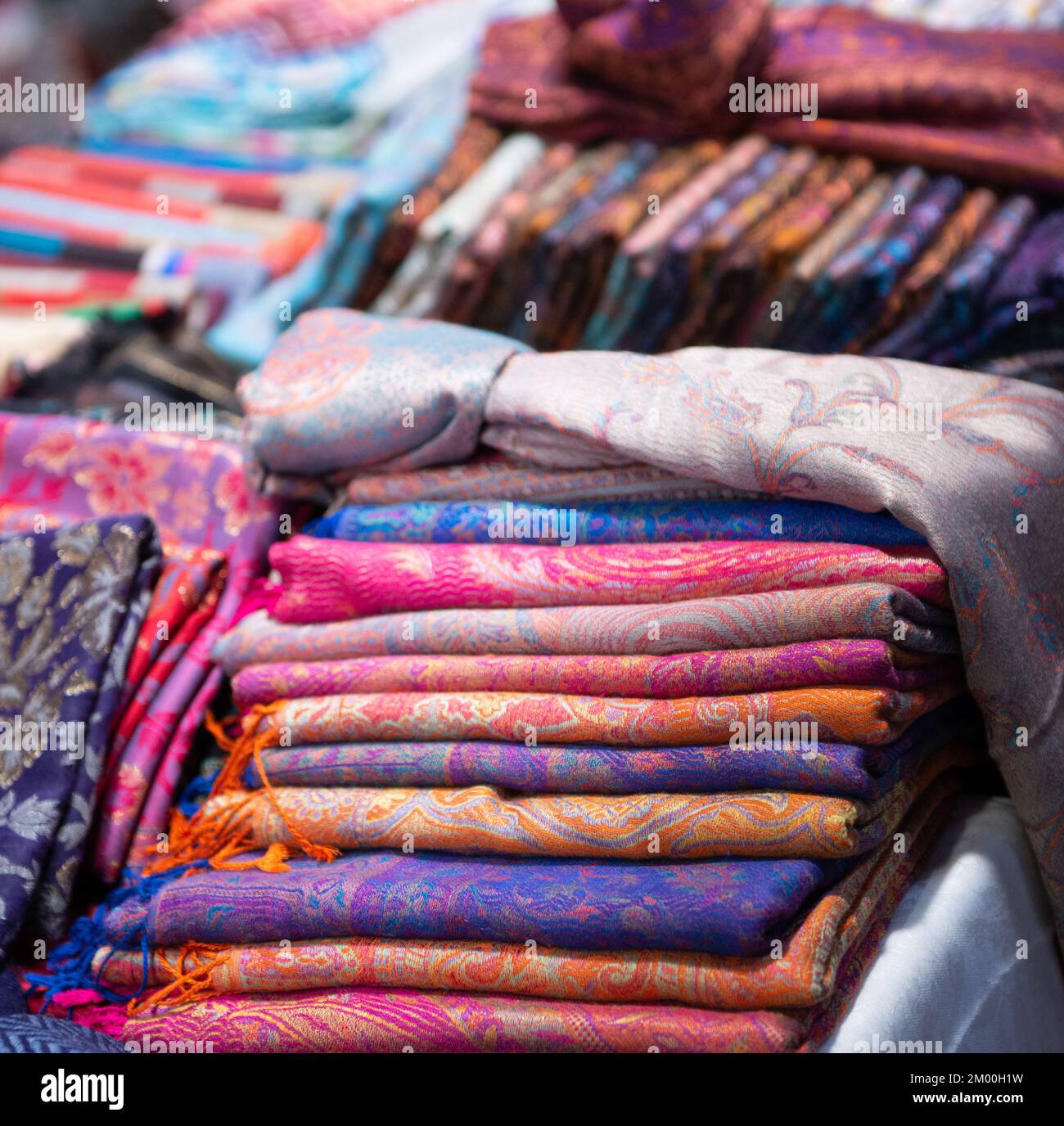 Colorful fabrics on display at the market Stock Photo - Alamy
