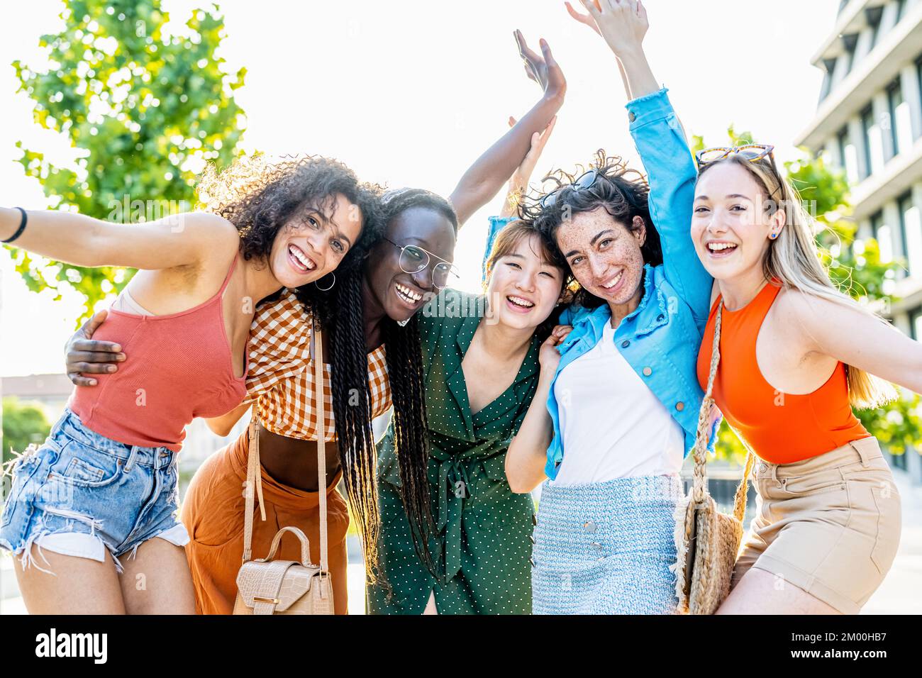 Group of five young women smiling and having fun, female university ...