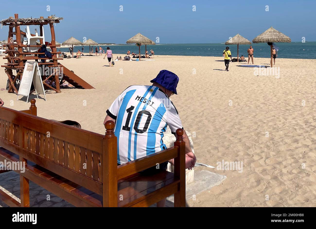 An Argentina fan wearing a Lionel Messi shirt on the beach at Al Wakrah ...