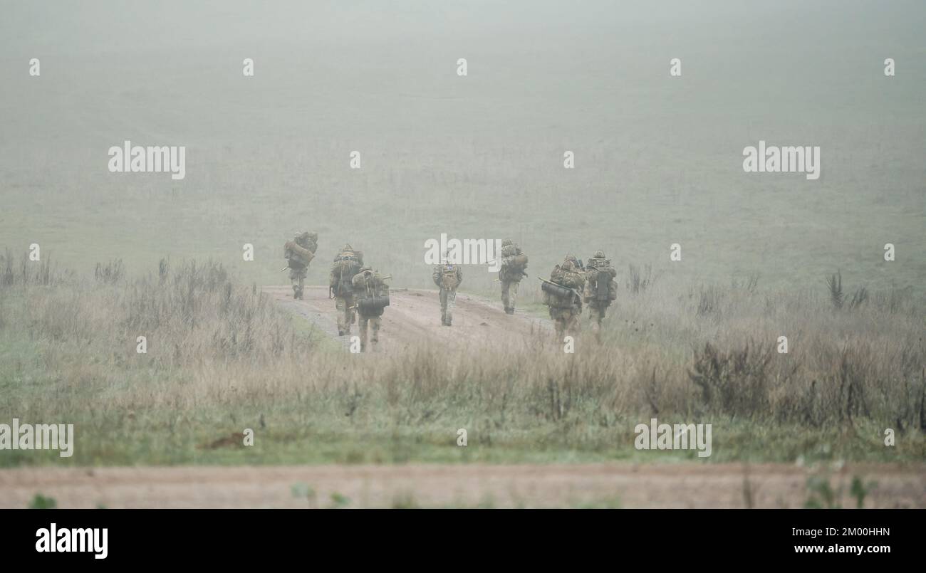 a unit of British army soldiers on a 40kg loaded march tab military ...