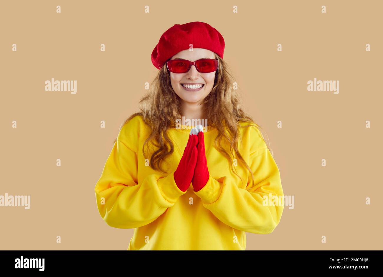 Portrait of excited happy woman who joyfully claps her hands in ...