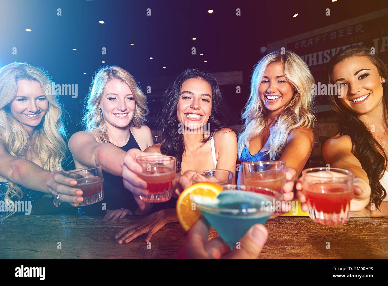 Cocktails, happy hour and friends at club with a toast to celebrate ...