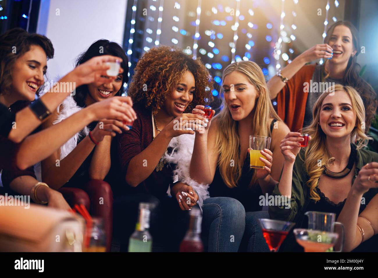 Party, nightclub and friends with alcohol shots for birthday ...