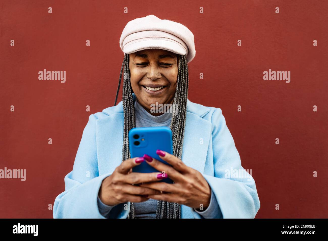 Smiling african woman braids using hi-res stock photography and images - Alamy