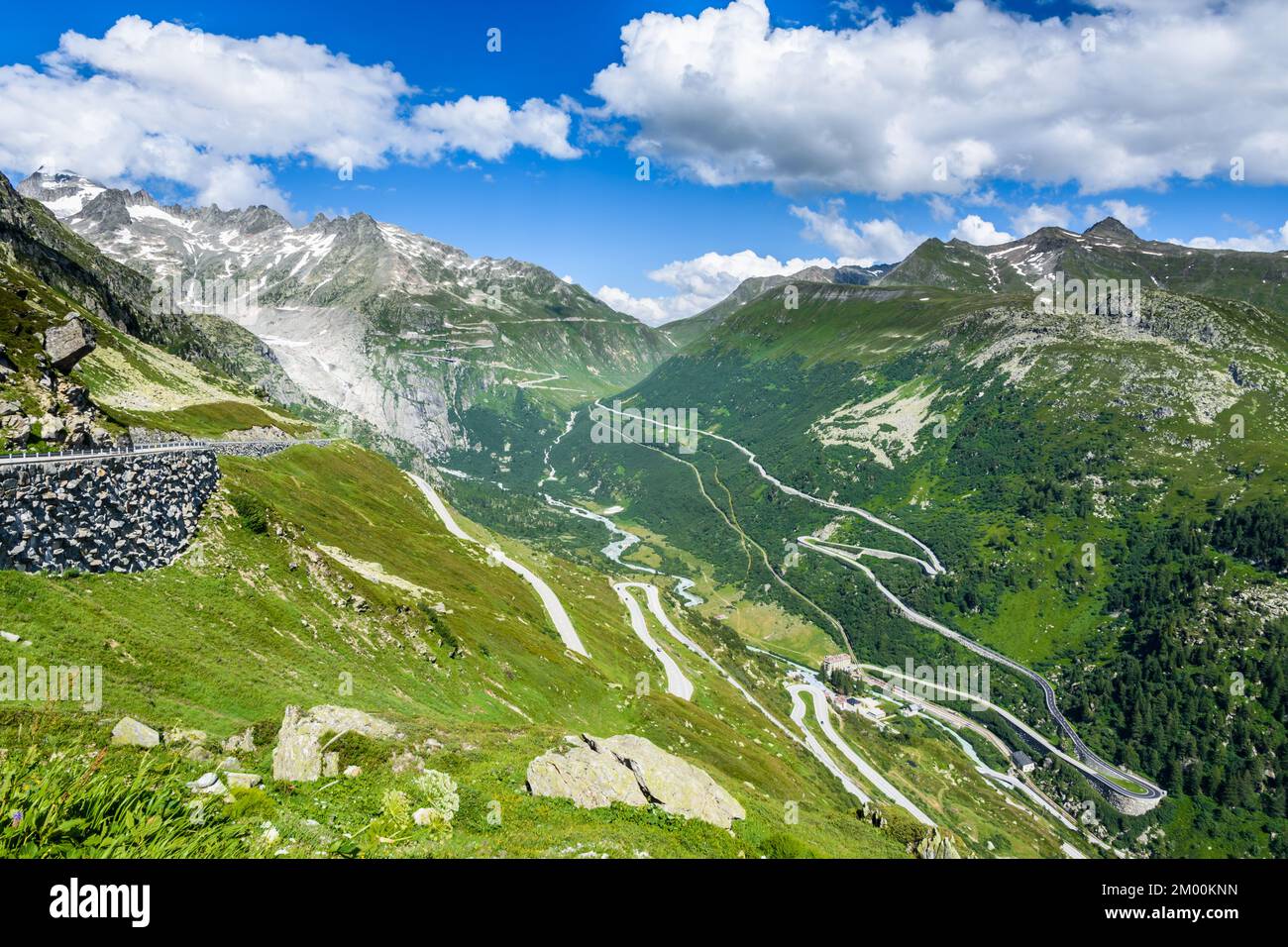 Winding pass road in the Swiss Alps, view from Grimsel Pass to Furka ...