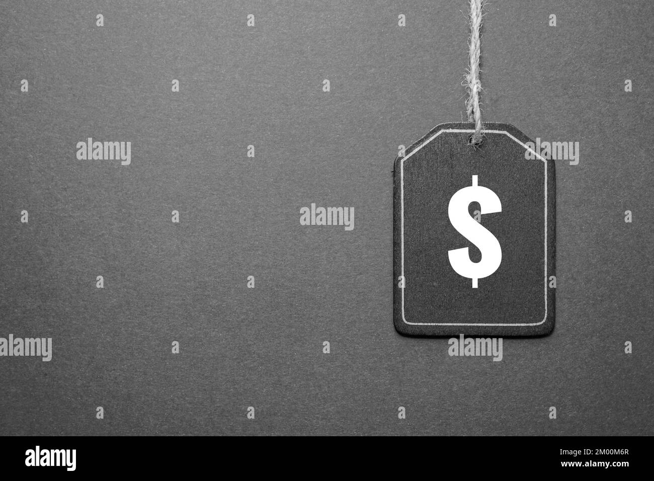 black price tag with dollar sign on the black background, black mockup ...