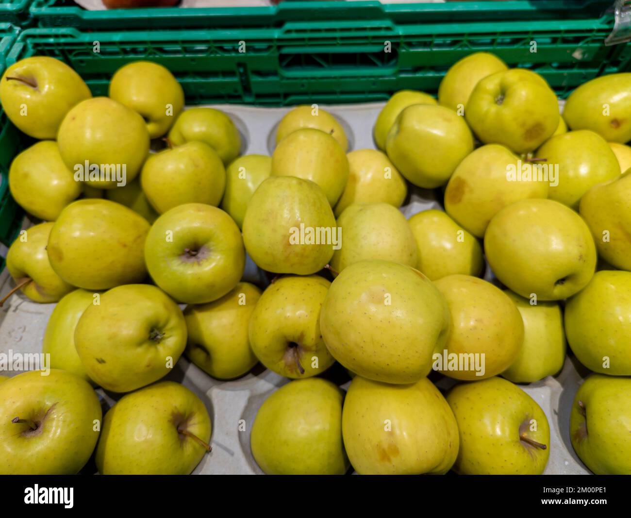 golden apples in a market, box with fresh apples for sale, healthy ...
