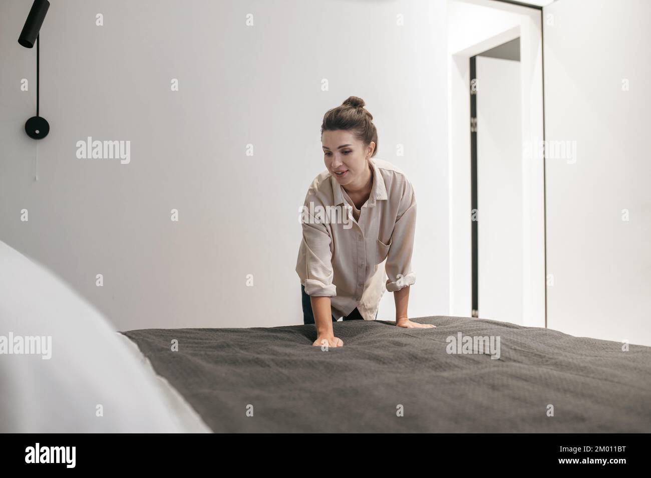 Household housewife making bed hi-res stock photography and images - Alamy