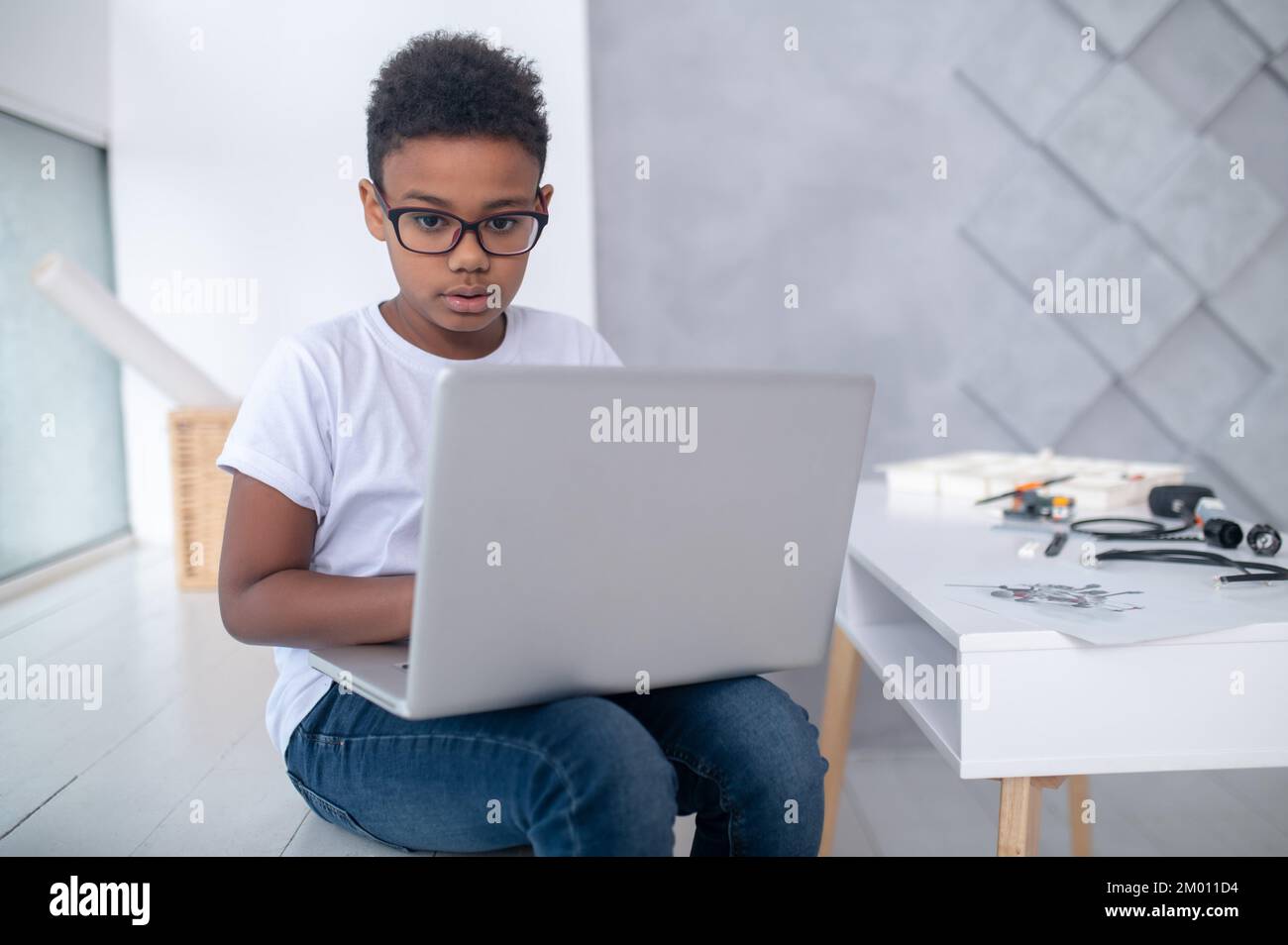 African teen boy laptop hi-res stock photography and images - Alamy