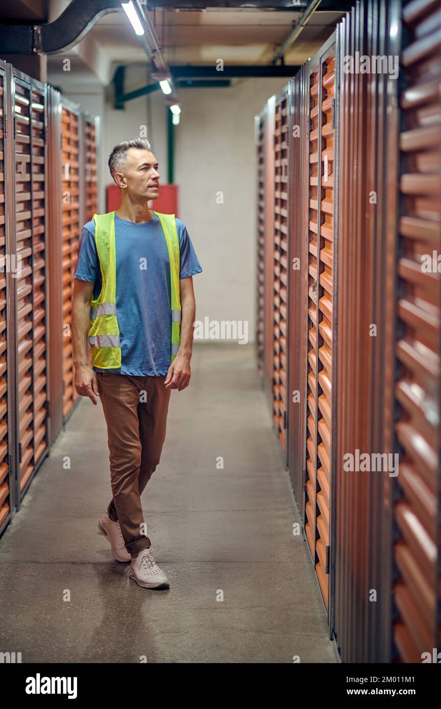 Worker walking warehouse hi-res stock photography and images - Alamy