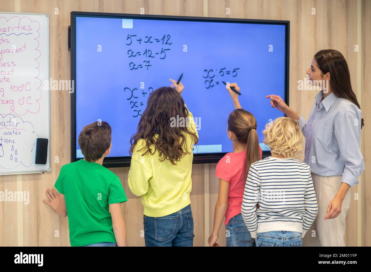 Child standing in classroom hi-res stock photography and images - Alamy