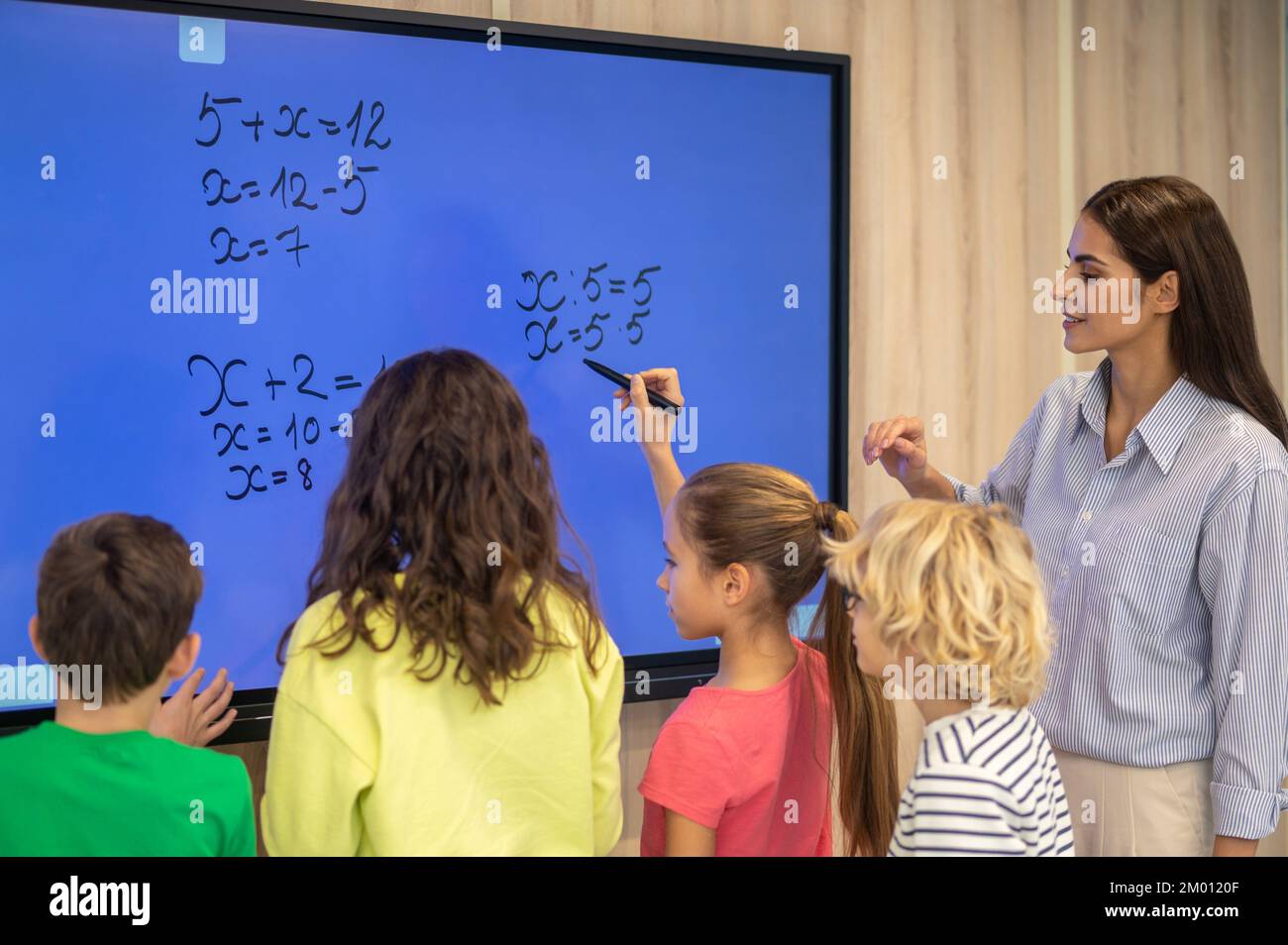 Teacher writing math equation on hi-res stock photography and images ...