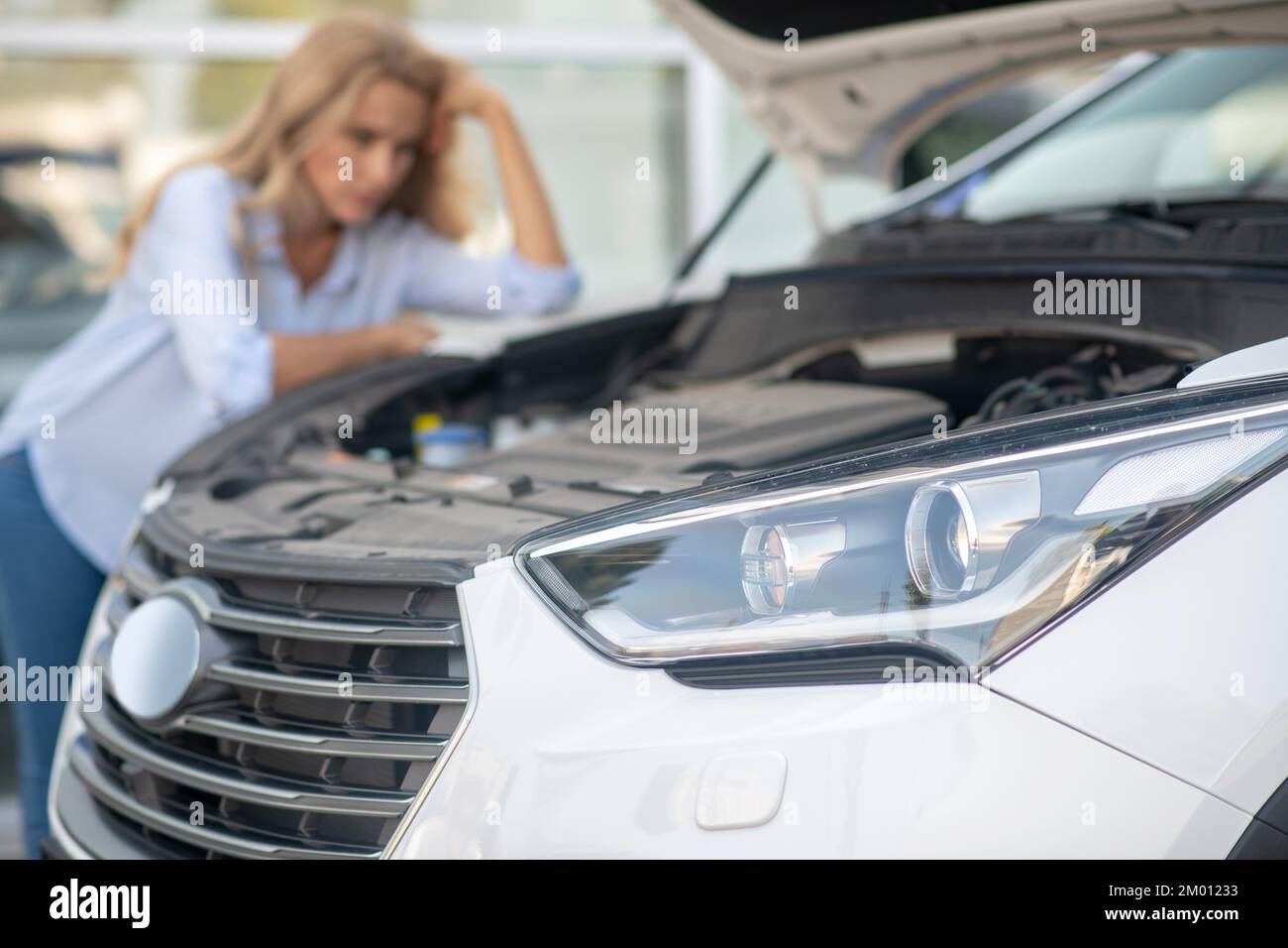 Woman fixing car engine hi-res stock photography and images - Alamy