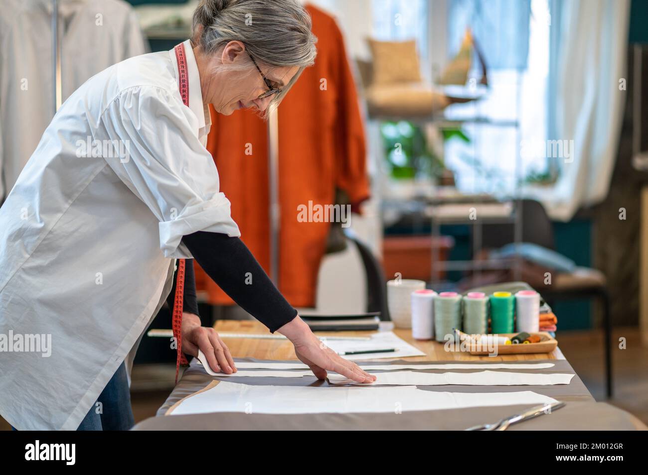 Laying out paper hi-res stock photography and images - Alamy