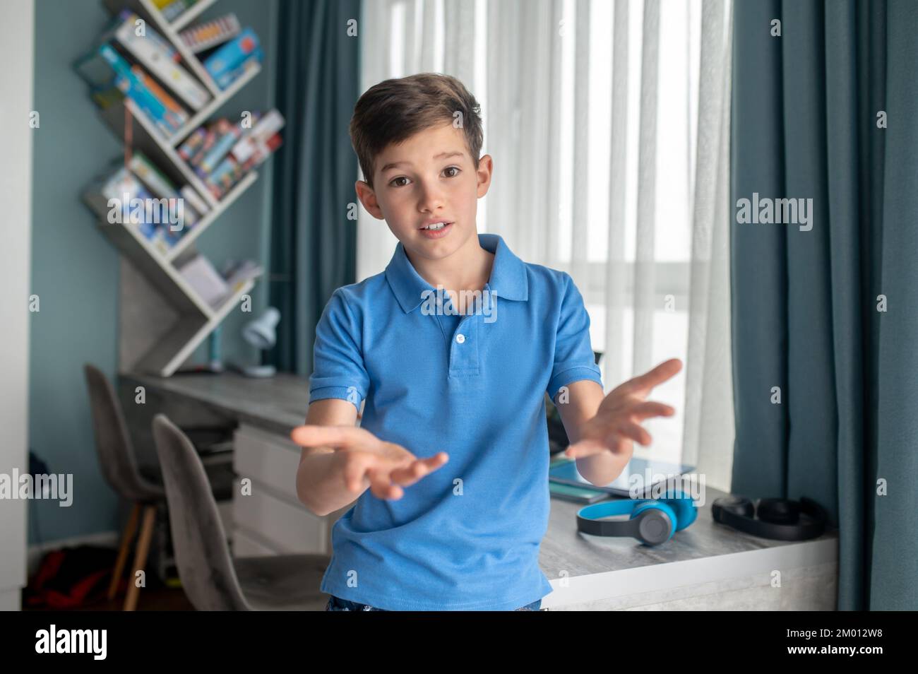 One boy standing hi-res stock photography and images - Alamy