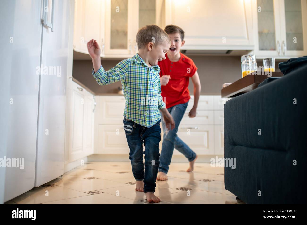 Kid running hi-res stock photography and images - Alamy