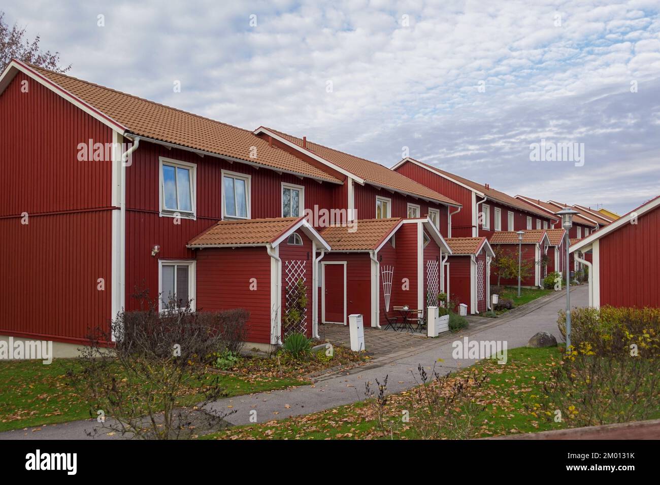 Image of Typical scandinavian style street with red wooden apartment ...