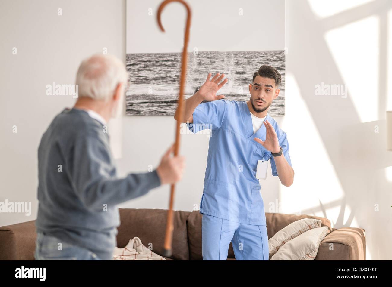 Man with walking stick hi-res stock photography and images - Alamy