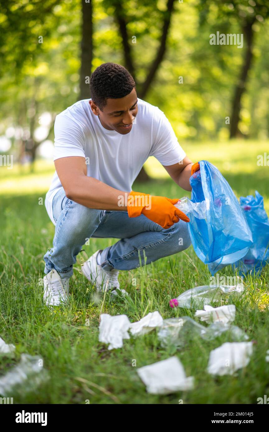 Man Picking Up Trash